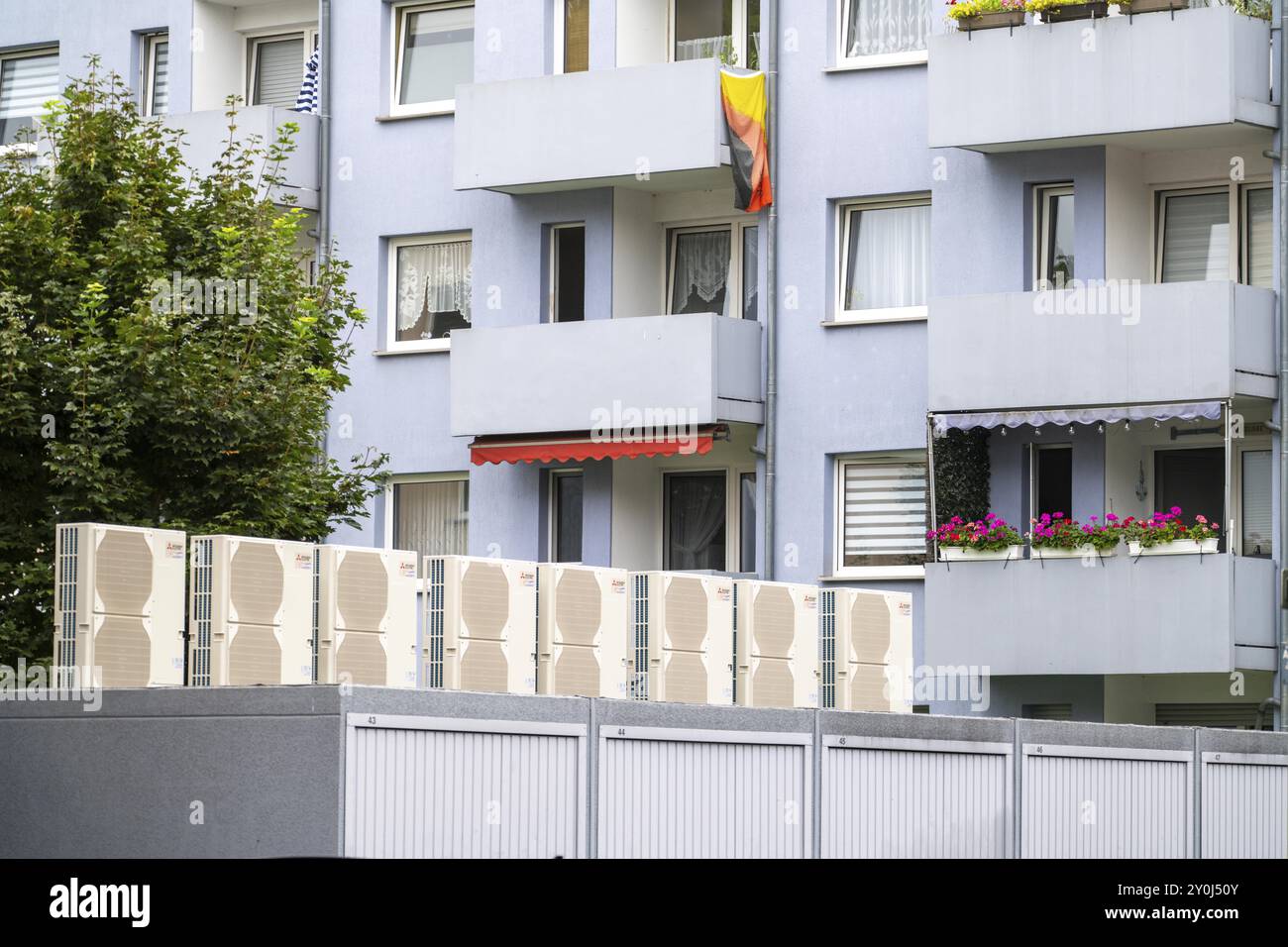 Heat pumps in a residential area, multi-family houses are supplied with ...