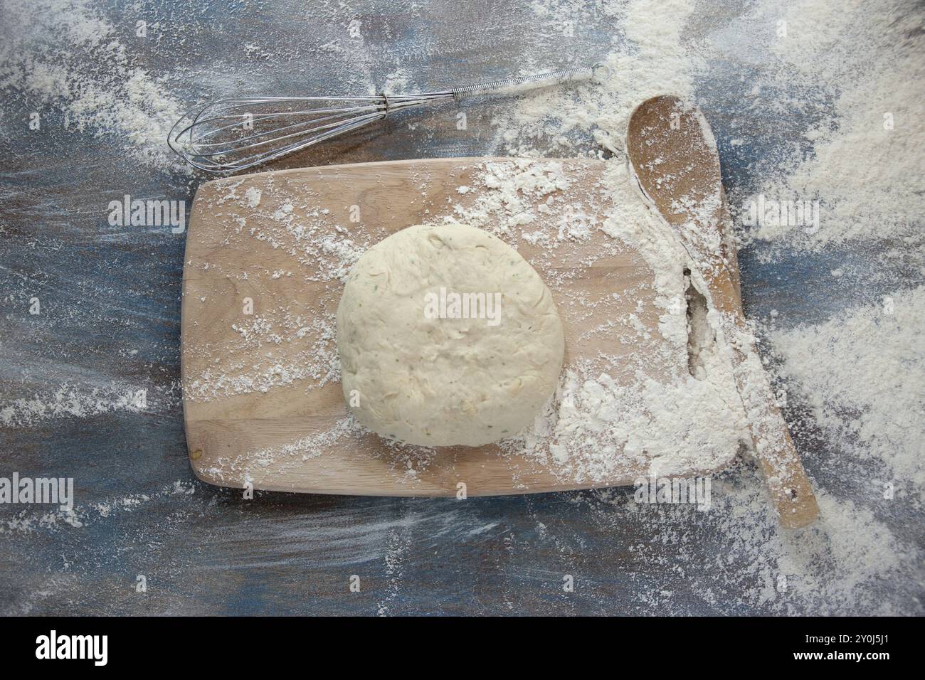 Pizza dough dropped on a pile of flour made this mess Stock Photo - Alamy