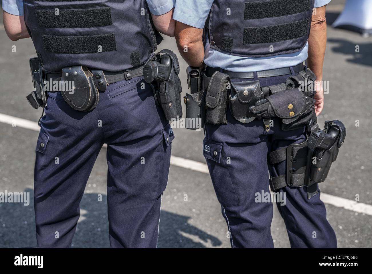 Police, police officer, policewoman, equipment belt with service weapon ...