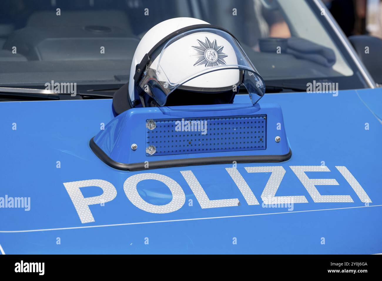 Police, patrol car, helmet lying on the bonnet, during a break ...