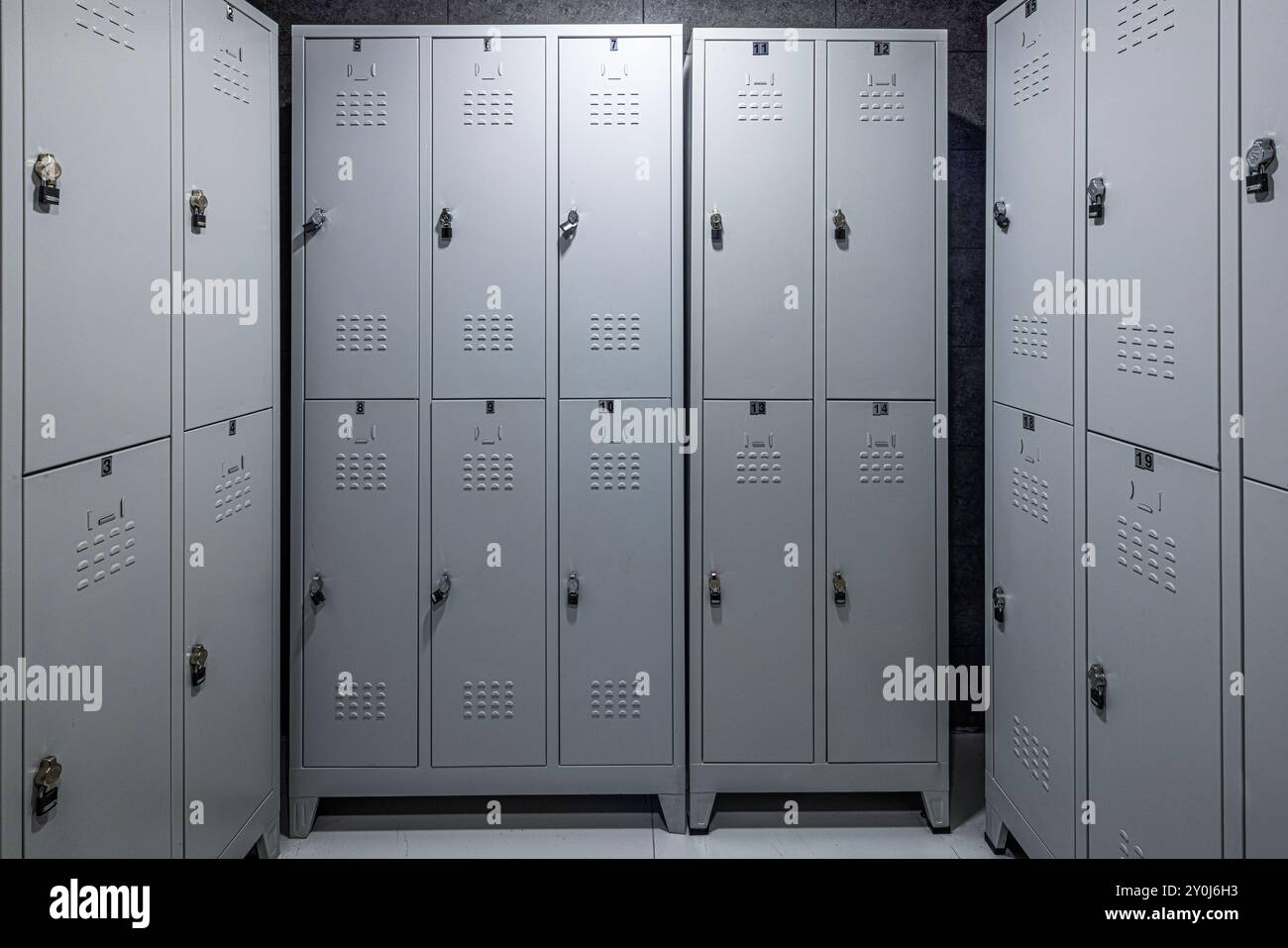 Metal dressing cabinets. Locker room for workers with ceramic tile ...