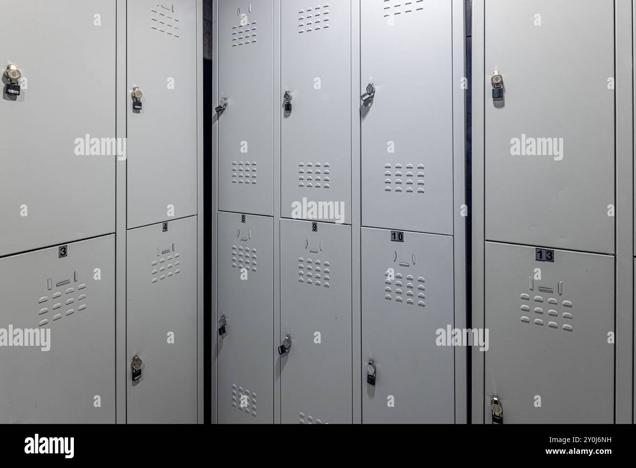 Metal dressing cabinets. Locker room for workers with ceramic tile ...