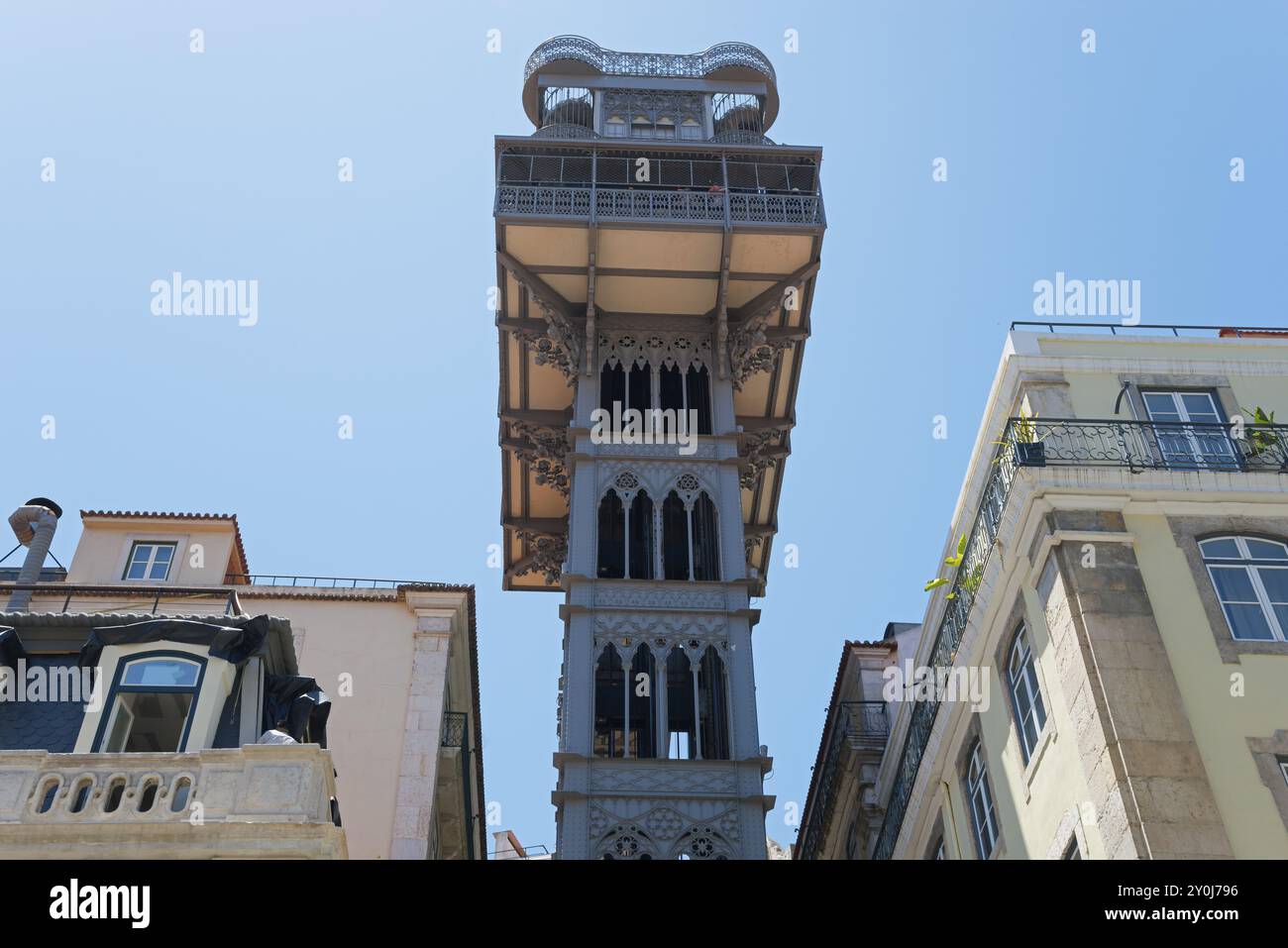 Historic Gothic style lift in Lisbon, rising between old buildings and ...