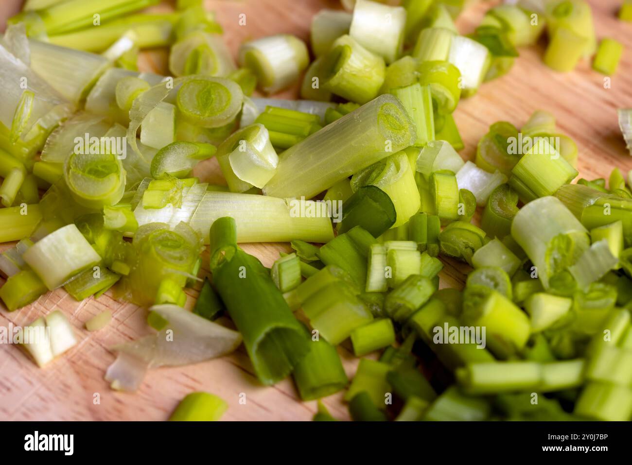Chopped green onions for use in salads, green onions are cut into ...