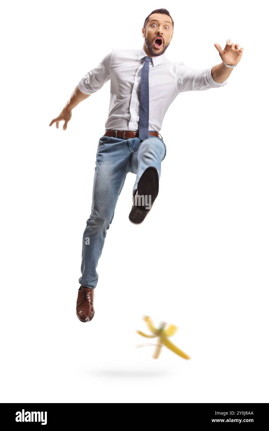 Businessman falling on a banana peel and screaming isolated on white ...