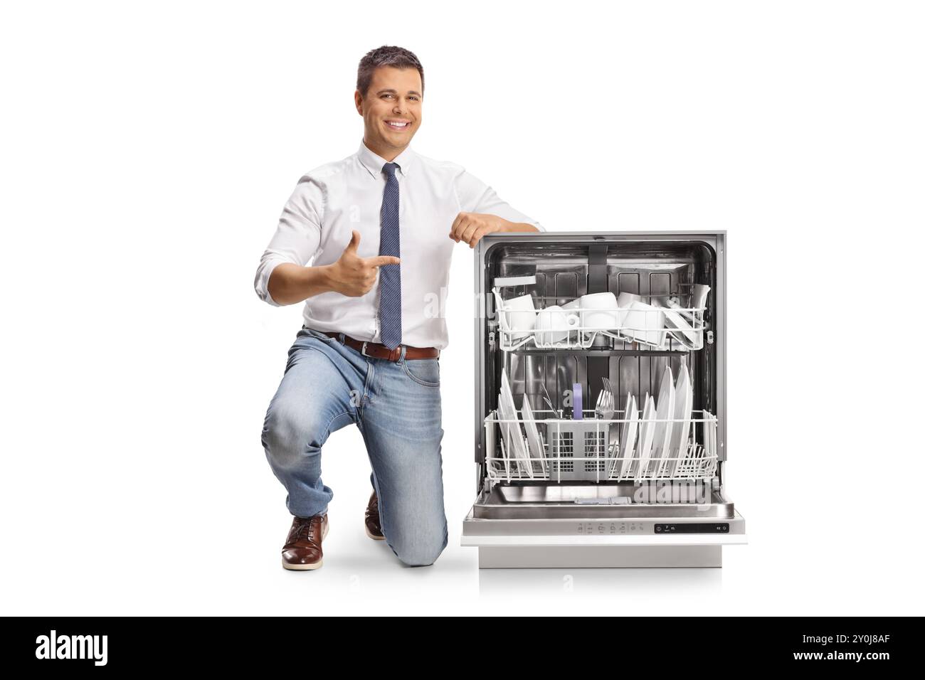 Businessman pointing at clean dishes inside a dishwasher isolated on ...