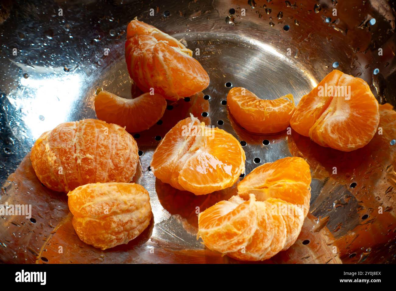 Mandarin orange segments in a stainless steel colander Stock Photo - Alamy