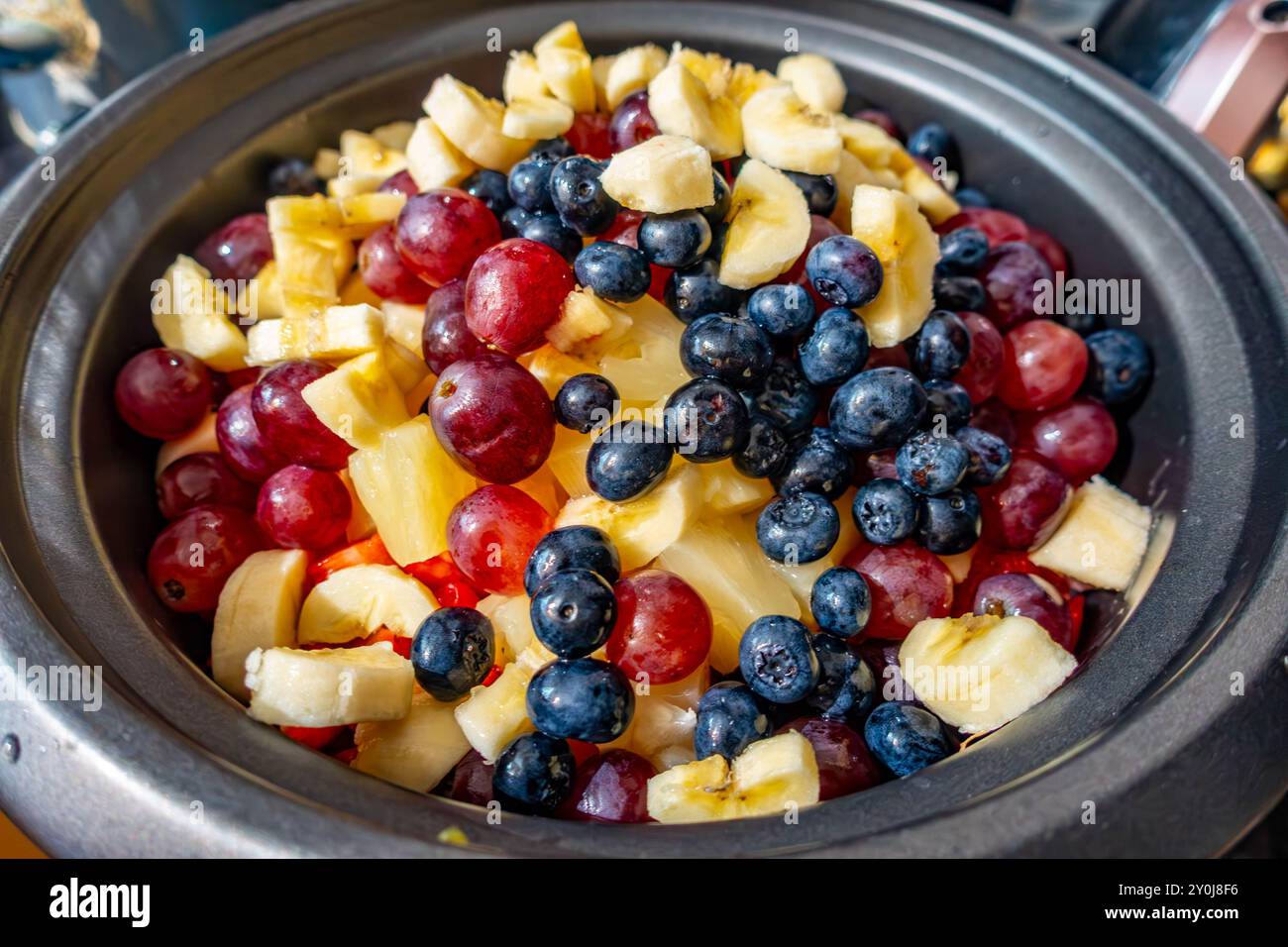 Chopped fruit in a bowl ready to make a fruit salad Stock Photo - Alamy