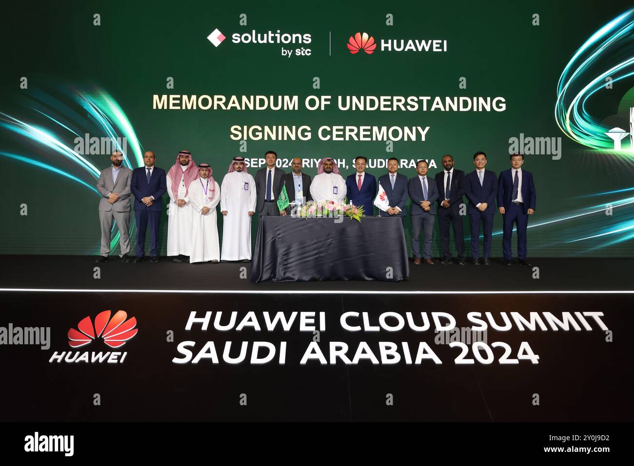 Riyadh, Saudi Arabia. 2nd Sep, 2024. People pose for a group photo at a signing ceremony during ...