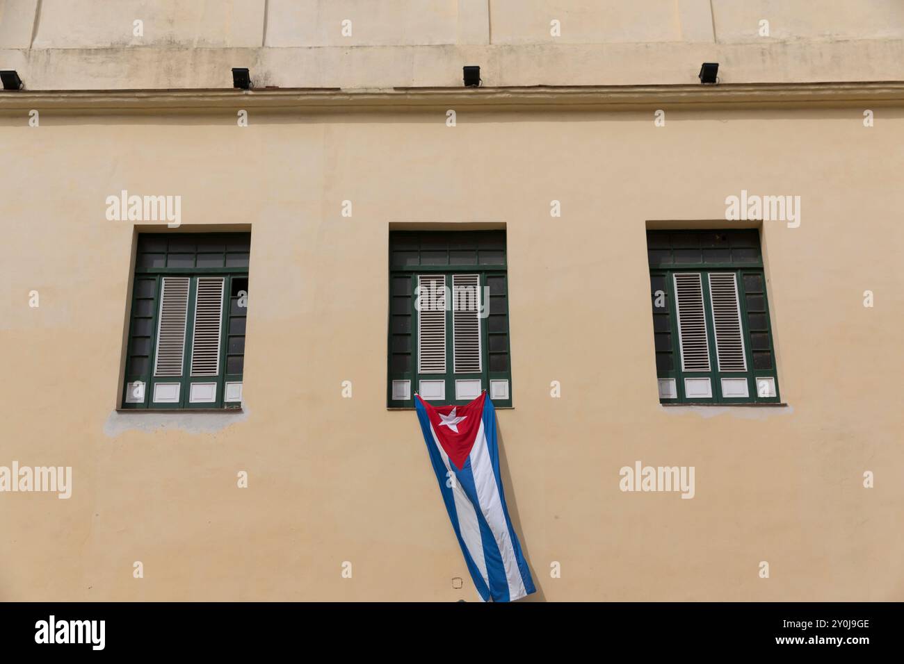 Cuba, Havana, building, shuttered windows, Cuban flag. 2016-03-25 Stock ...