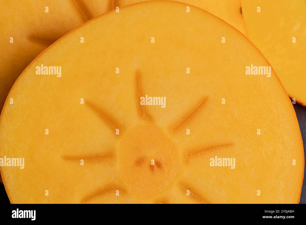 Half-cut ripe and sweet persimmon, details of the pulp of ripe ...
