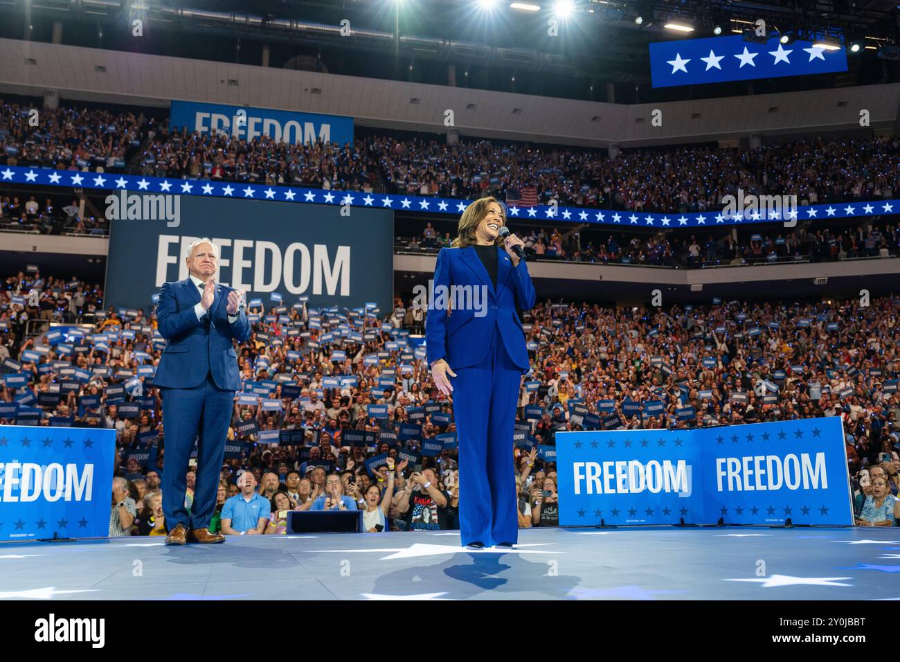 Vice President Kamala Harris, and her running mate, Tim Walz, speak at ...