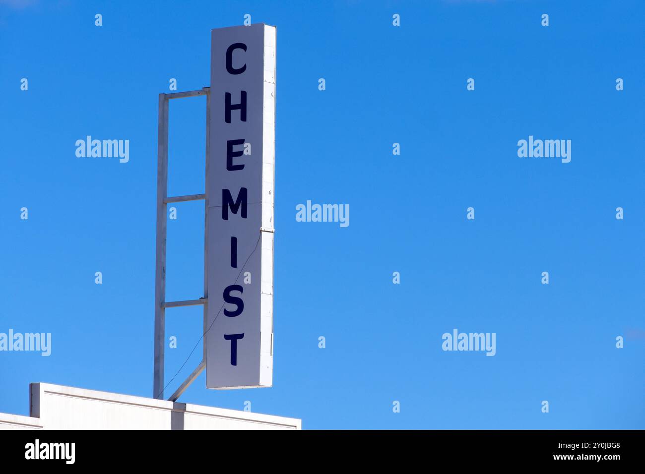 Chemist sign and blue sky, Western Australia Stock Photo - Alamy