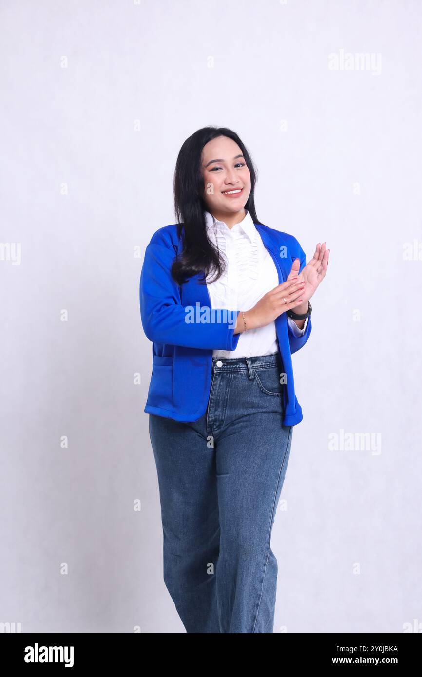 beautiful young asian office woman wearing blue formal suit standing cheerful hands clapping ...