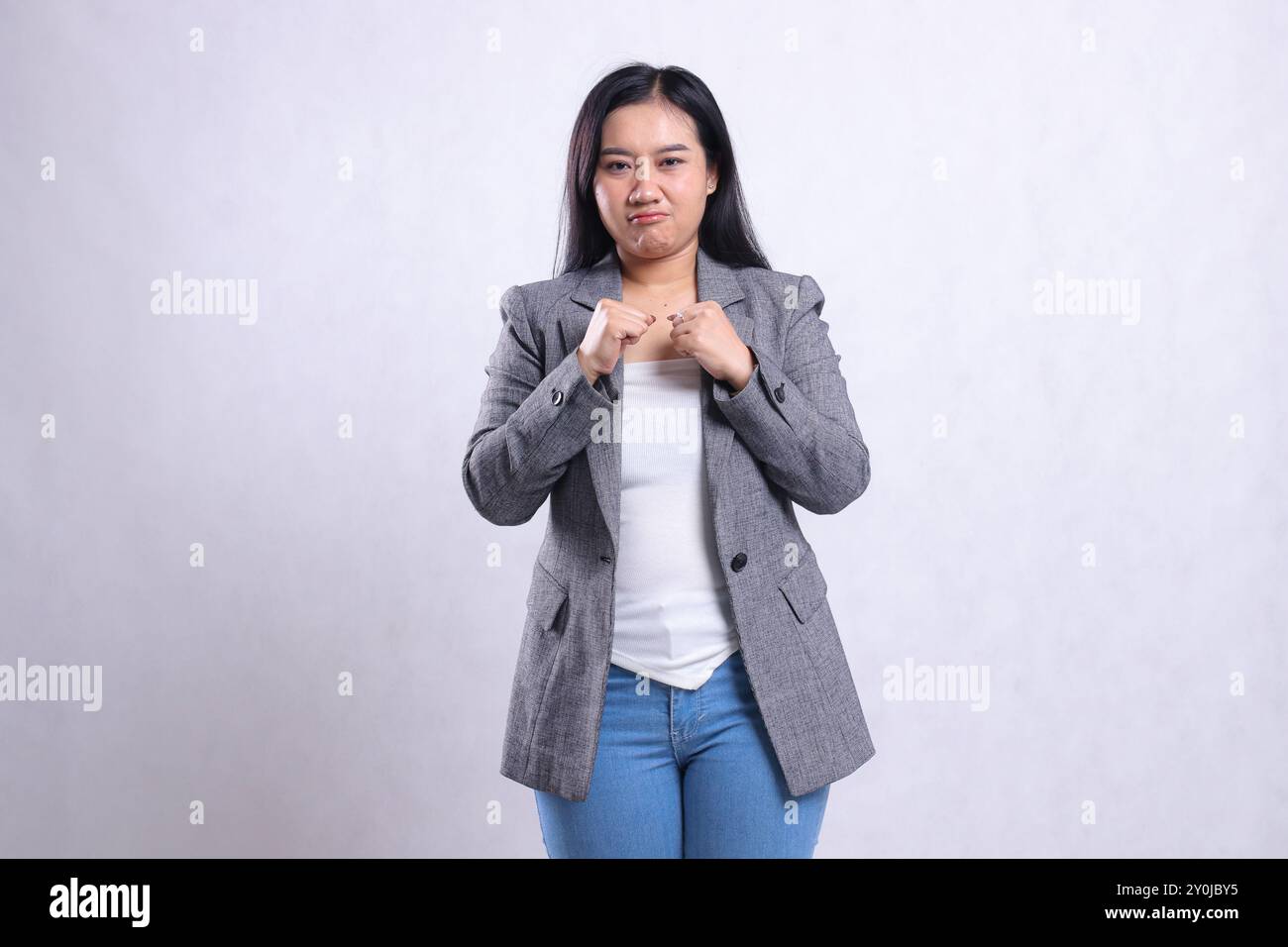 expression of beautiful adult woman pouting both hands clenched in ...