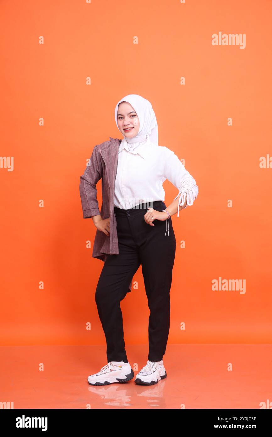 Full length portrait of beautiful Muslim asian girl model smile holding ...