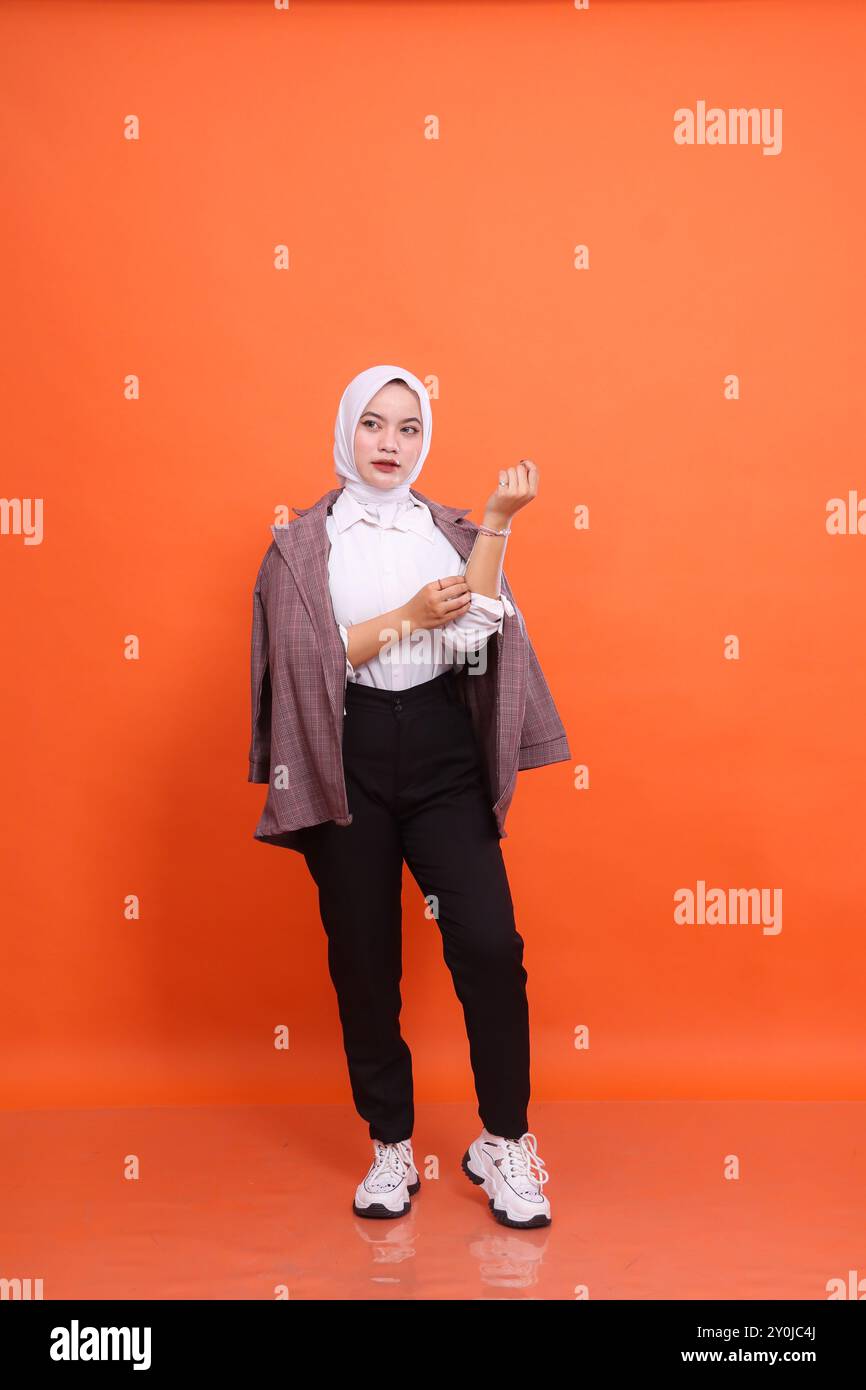 Full length portrait of beautiful elegant Muslim Asian girl candid ...
