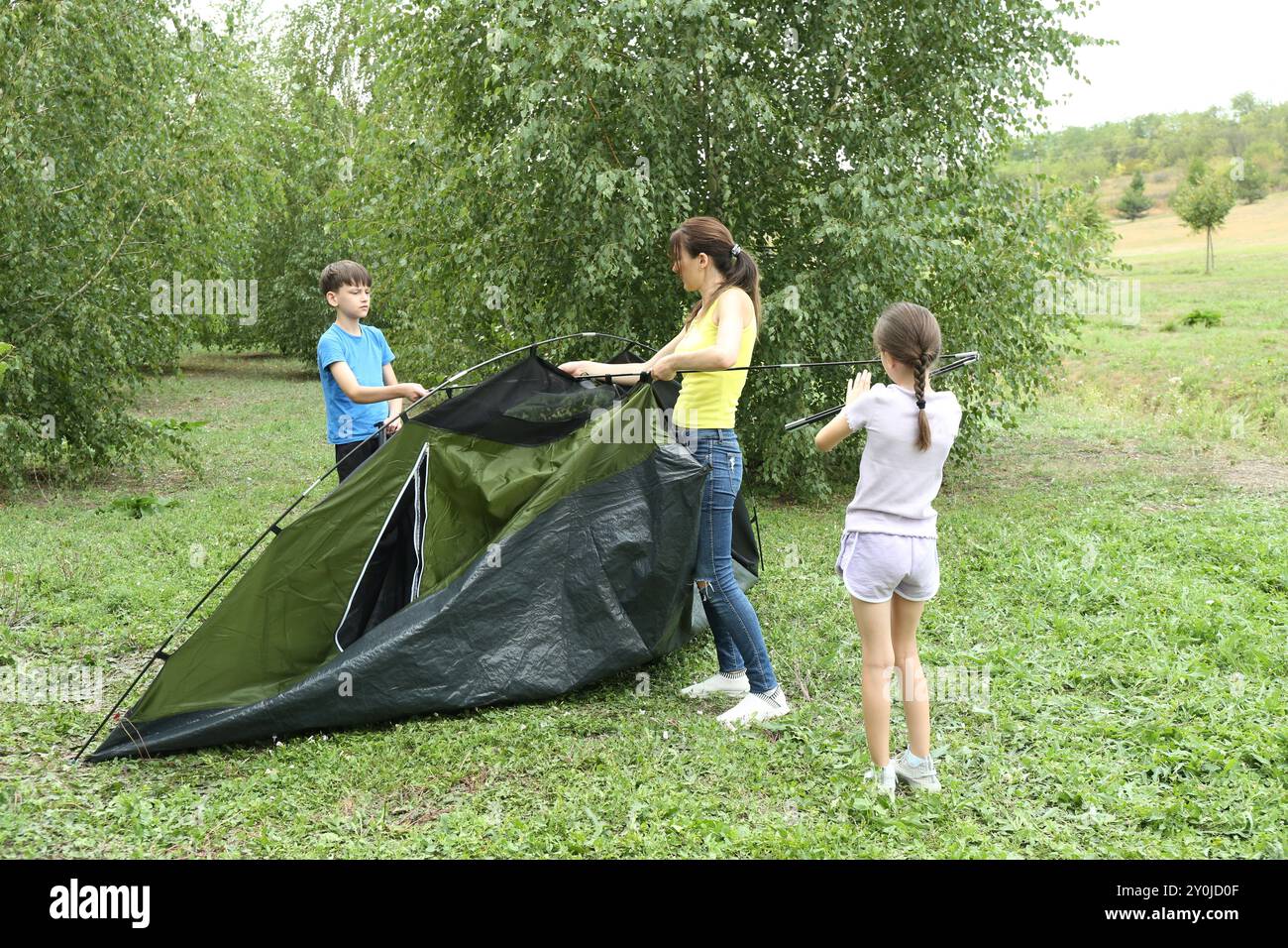 Setting up tent boy and girl hi-res stock photography and images - Alamy