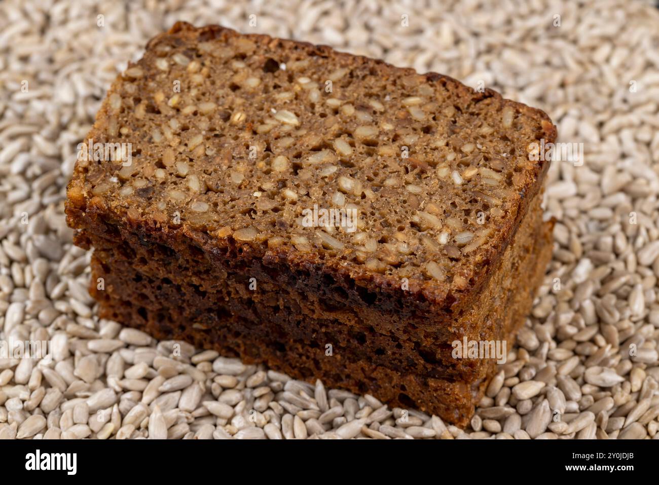 Black rye bread cut into chunks with sunflower seeds, a loaf of bread ...