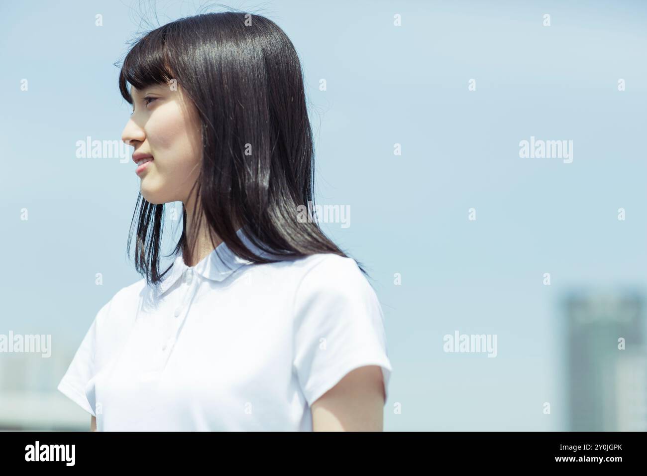 High school girl staring into the distance Stock Photo - Alamy