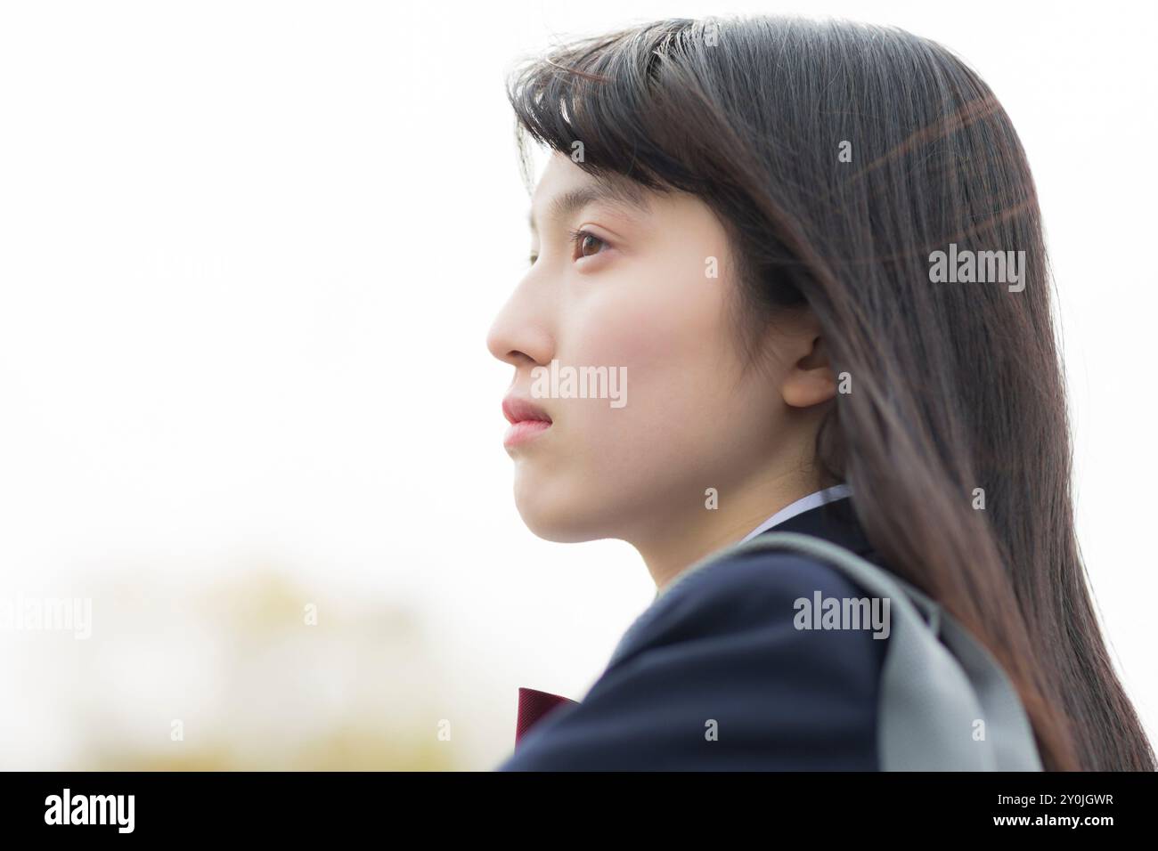 High school girl staring into the distance Stock Photo - Alamy