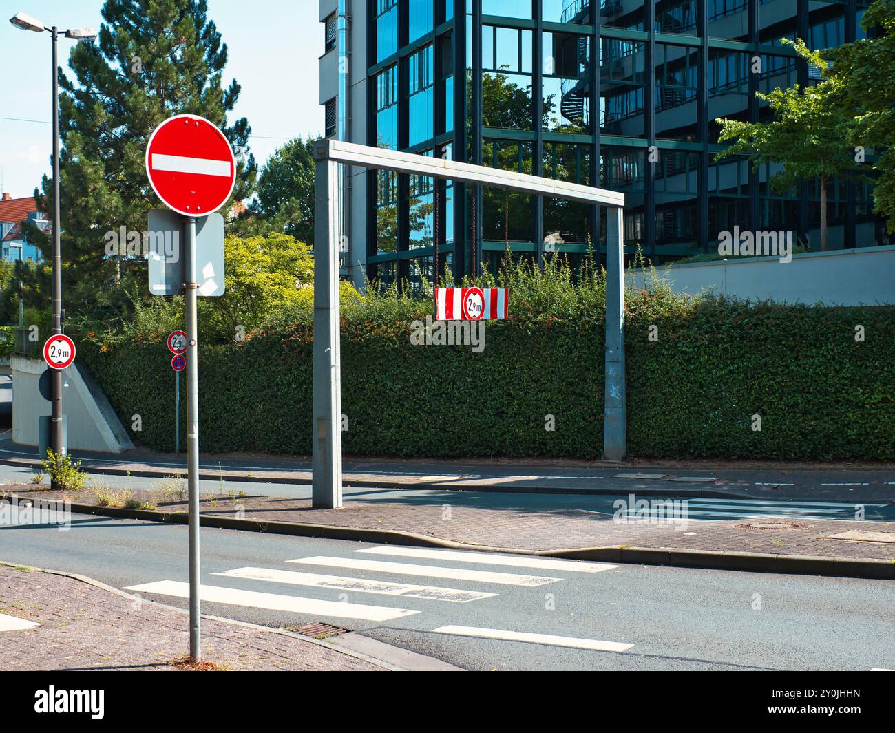 Road leading into the tunnel with a warning sign and a marking that can ...