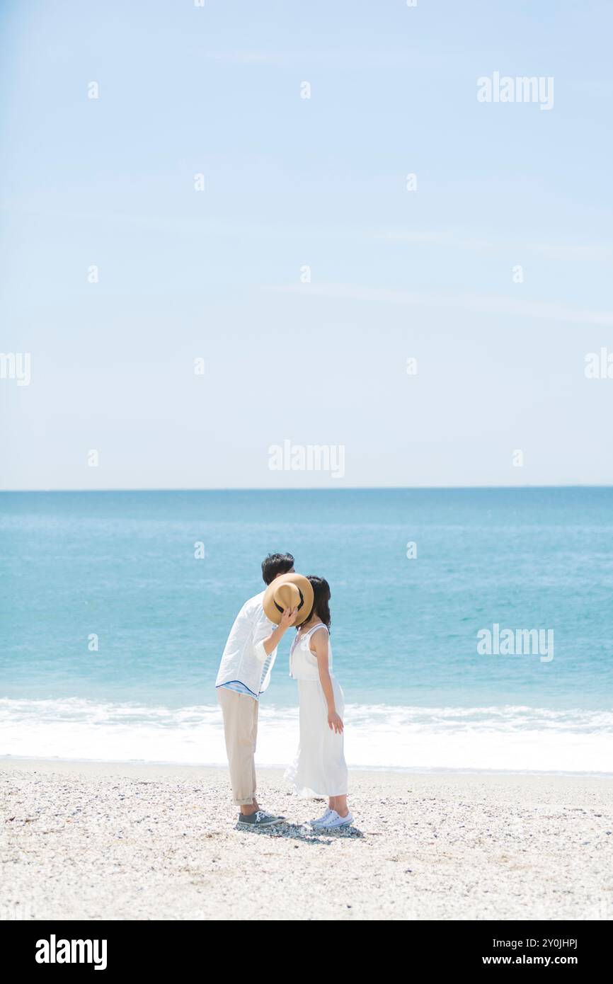 Couple kissing in secret Stock Photo - Alamy