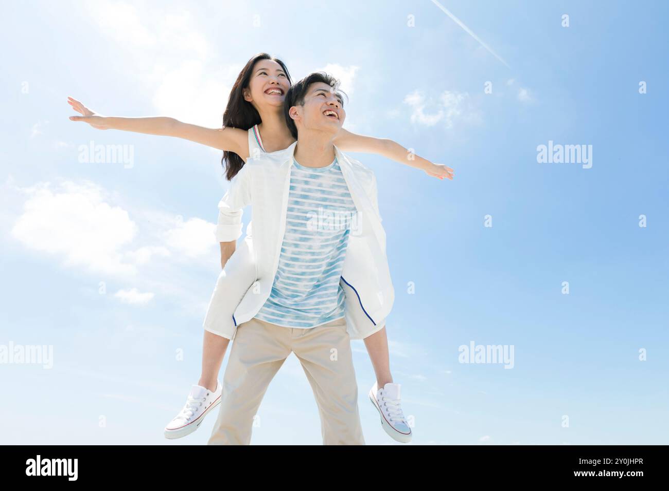 Man carrying her on his back Stock Photo - Alamy