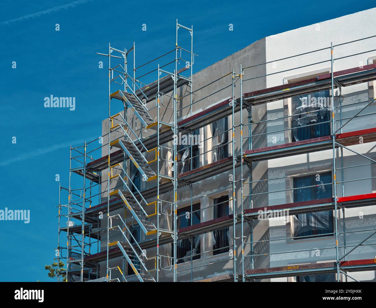 The new construction of a high-rise building in detail with scaffolding ...