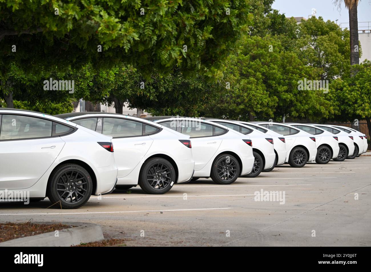 Tesla Model 3 vehicles are stored in a parking lot at San Bernardino ...