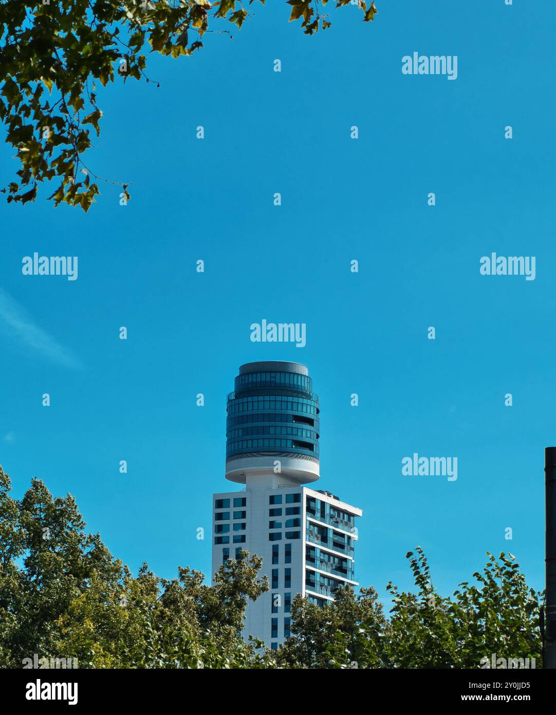 A skyscraper, office building in Frankfurt am Main on a blue sky with a ...