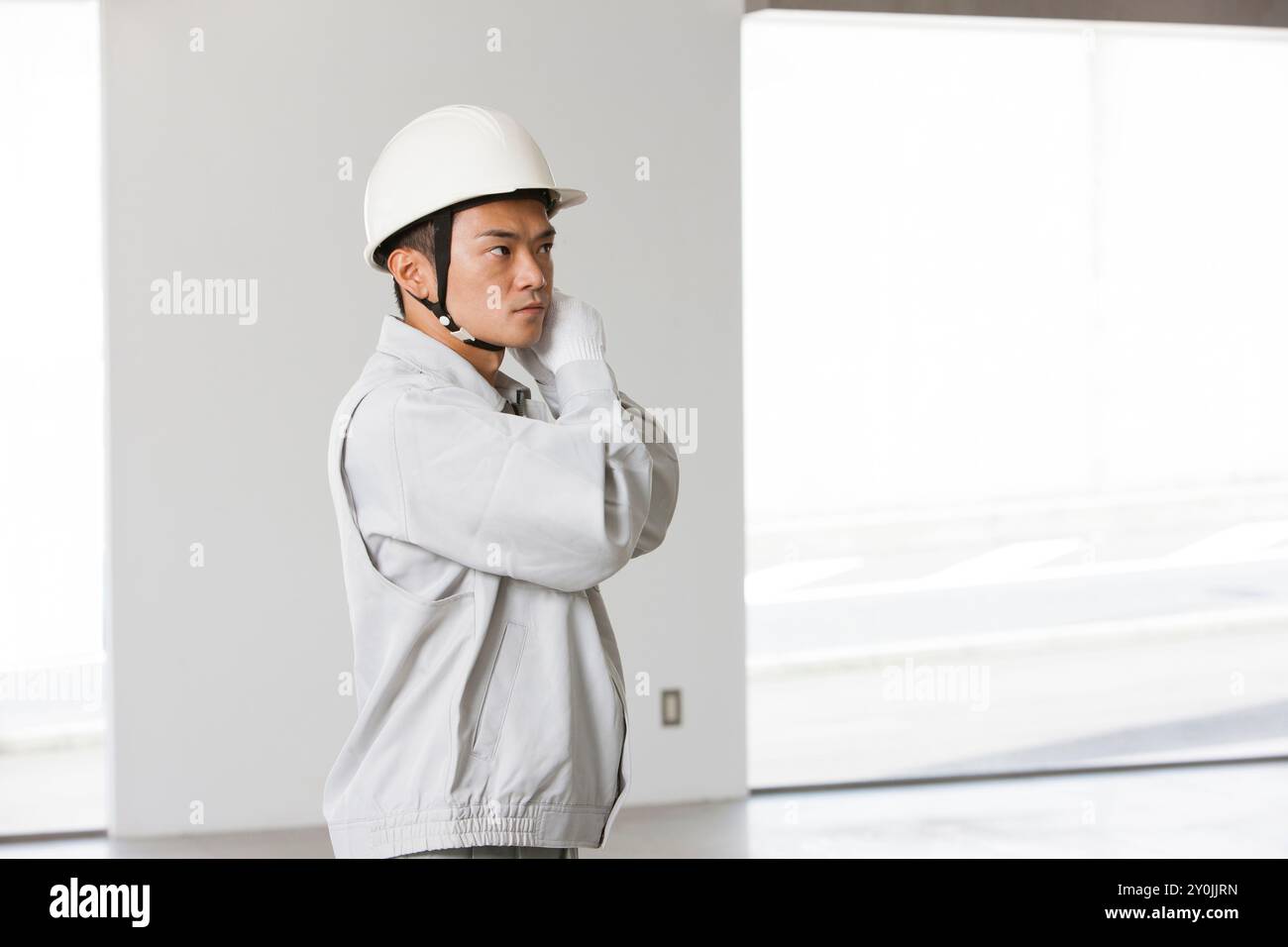 Worker wearing helmet hi-res stock photography and images - Alamy