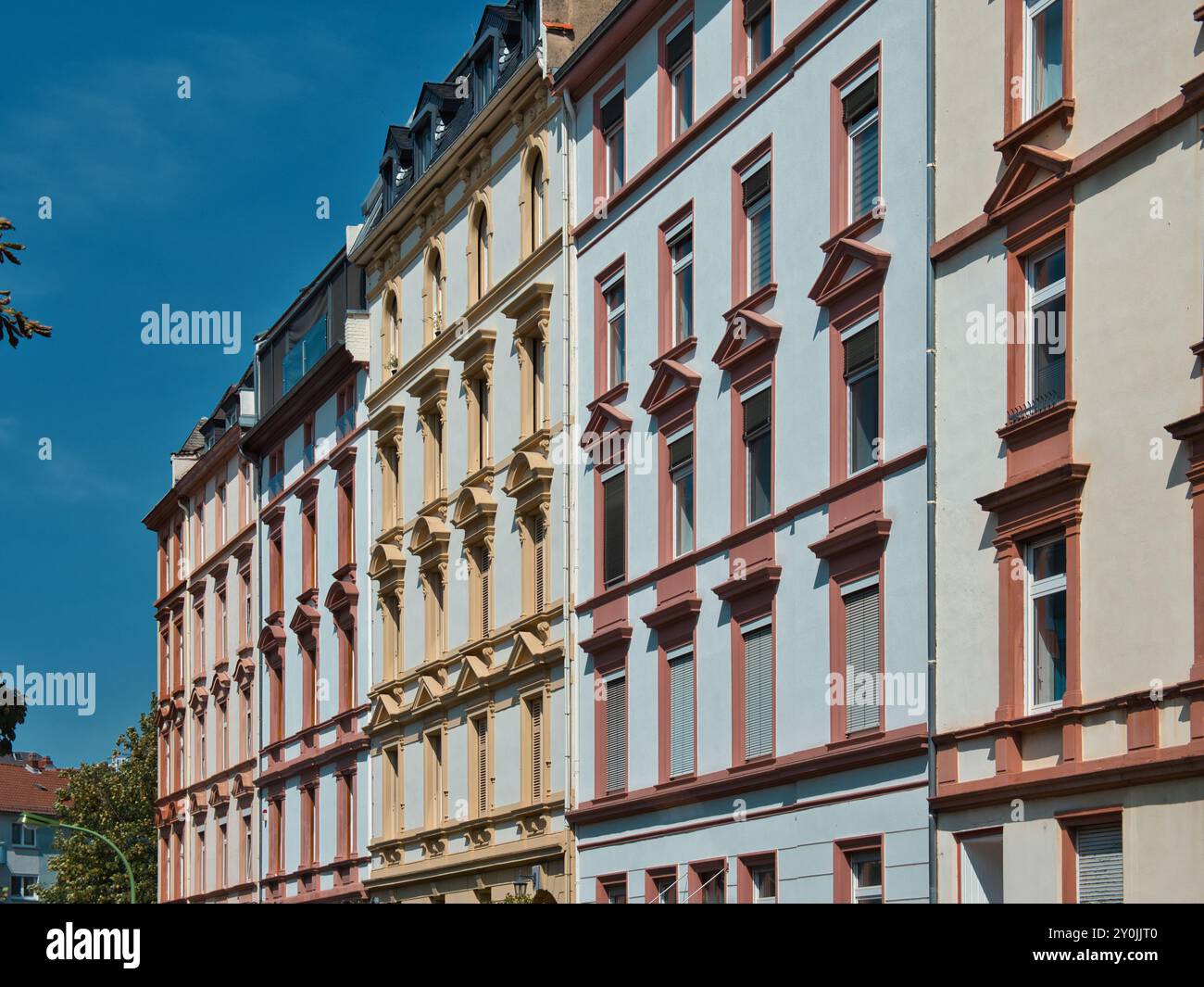 A side shot of historic buildings with beautiful, decorated windows and ...
