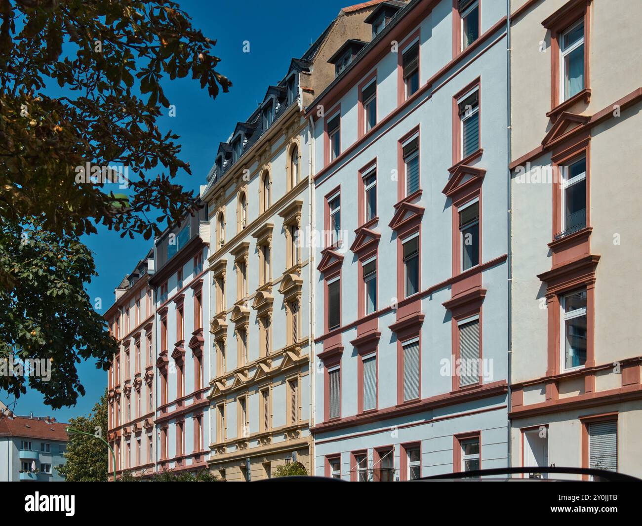 A side shot of historic buildings with beautiful, decorated windows and ...