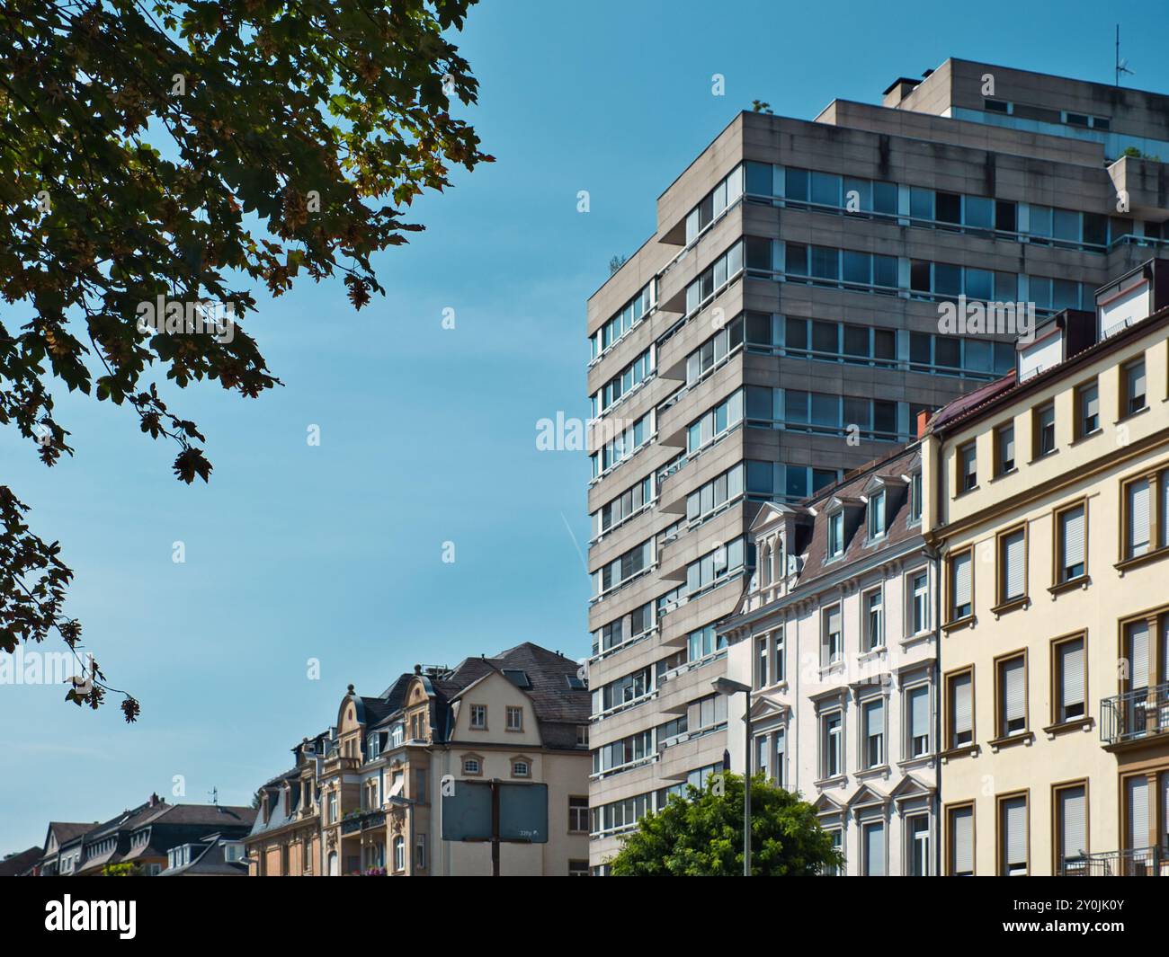 A large office complex, as it has double the height of neighboring ...