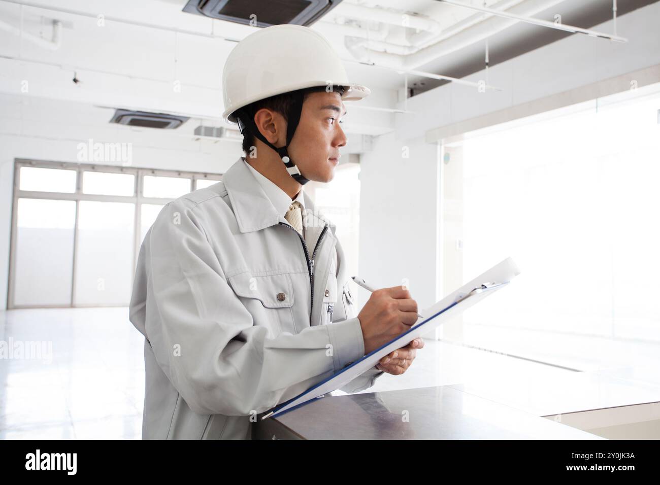 Site foreman checking the construction site Stock Photo - Alamy