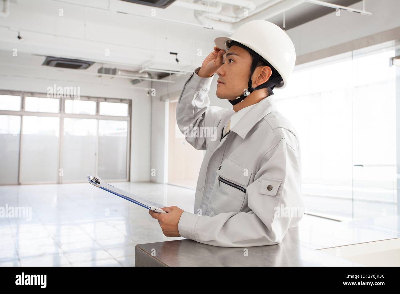Site foreman checking the construction site Stock Photo - Alamy