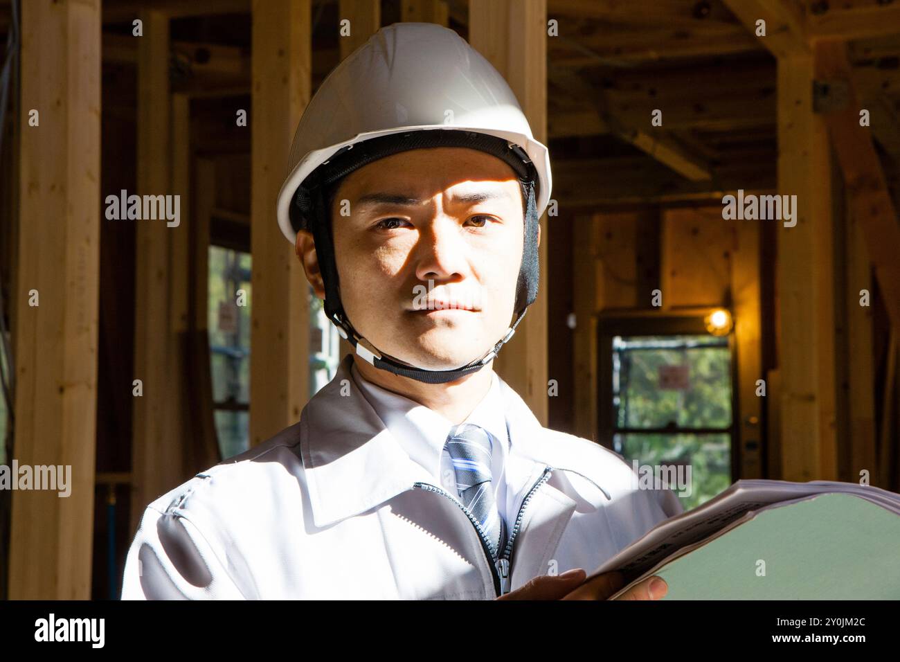 Site foreman checking the inside of a house under construction Stock ...