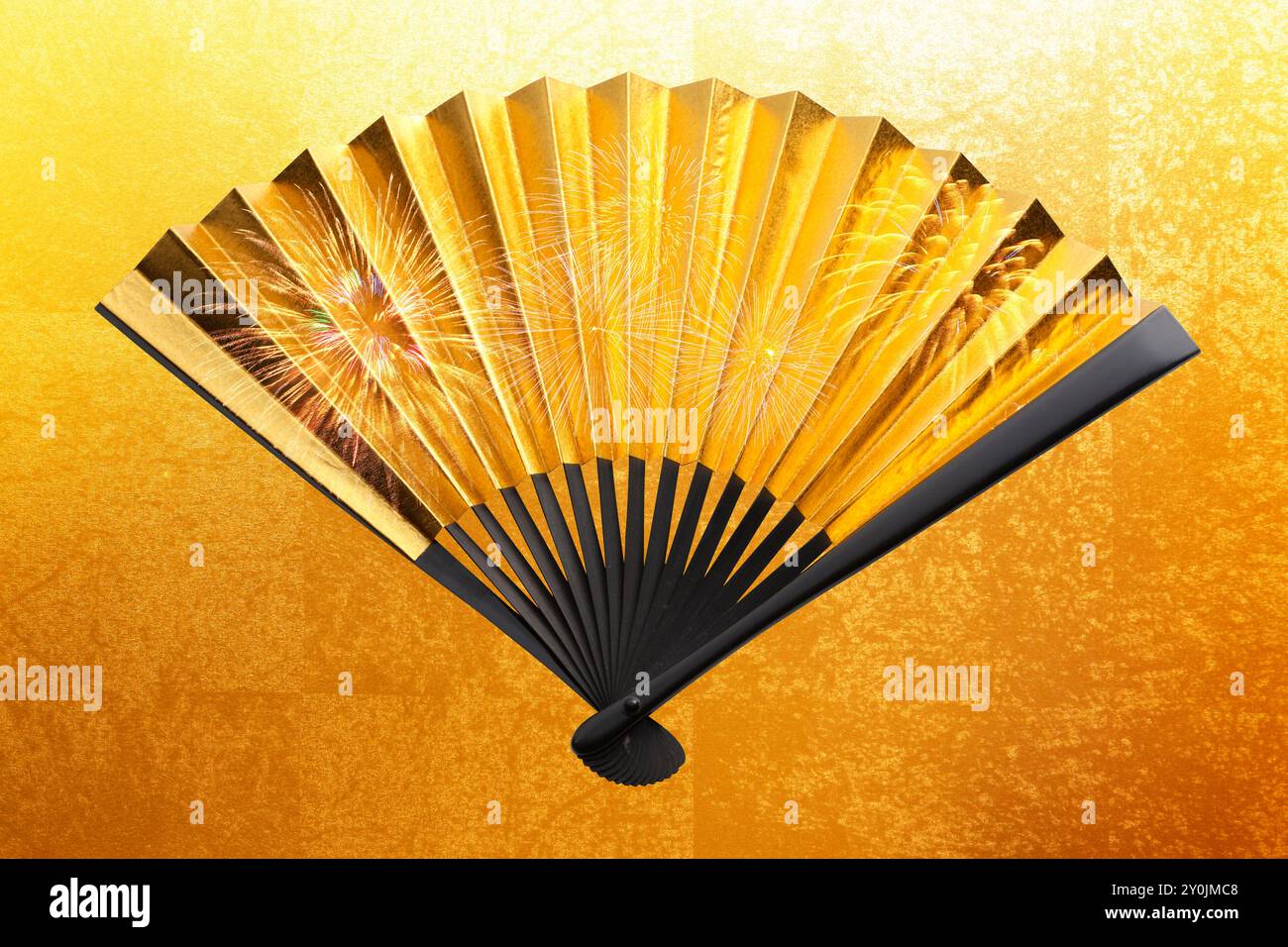 Golden fan and fireworks Stock Photo - Alamy