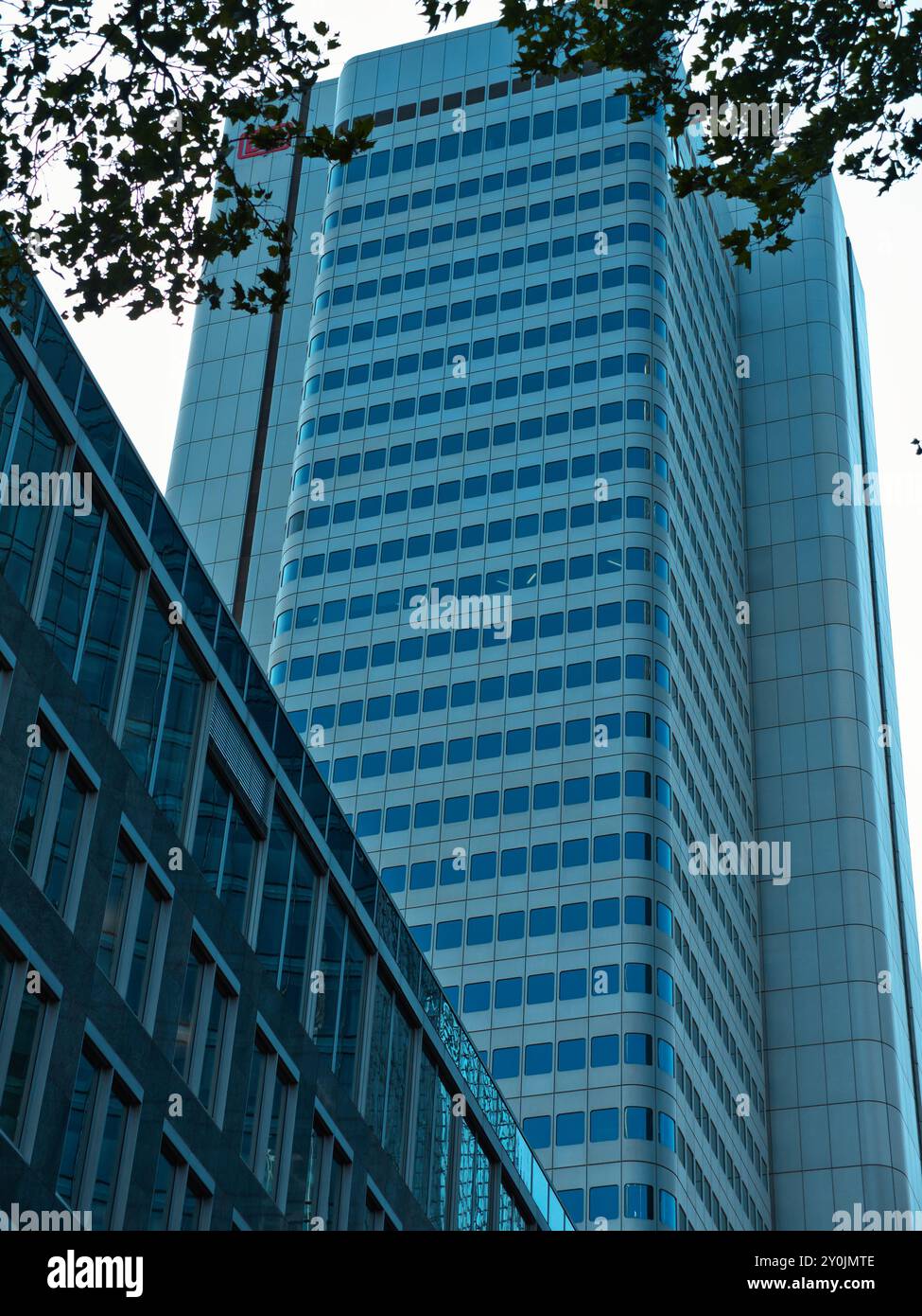 Detail shots of high-rise buildings with a bluish facade and a ...