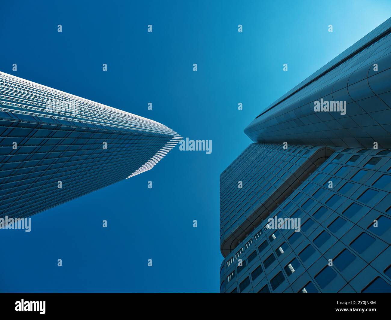 A shot between the skyscraper towers racing through the sky with blue ...