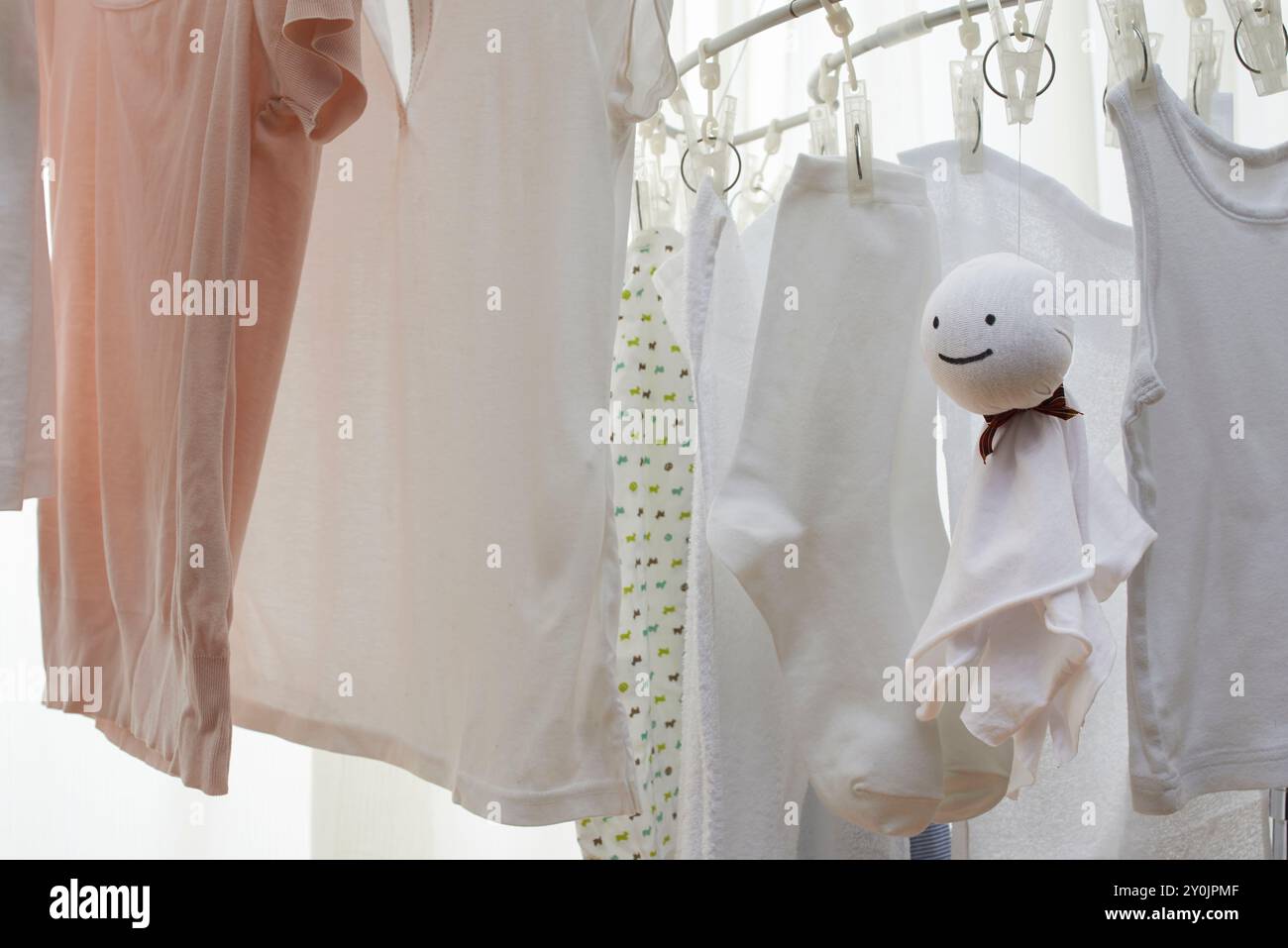 Indoor drying laundry and a paper doll Stock Photo - Alamy