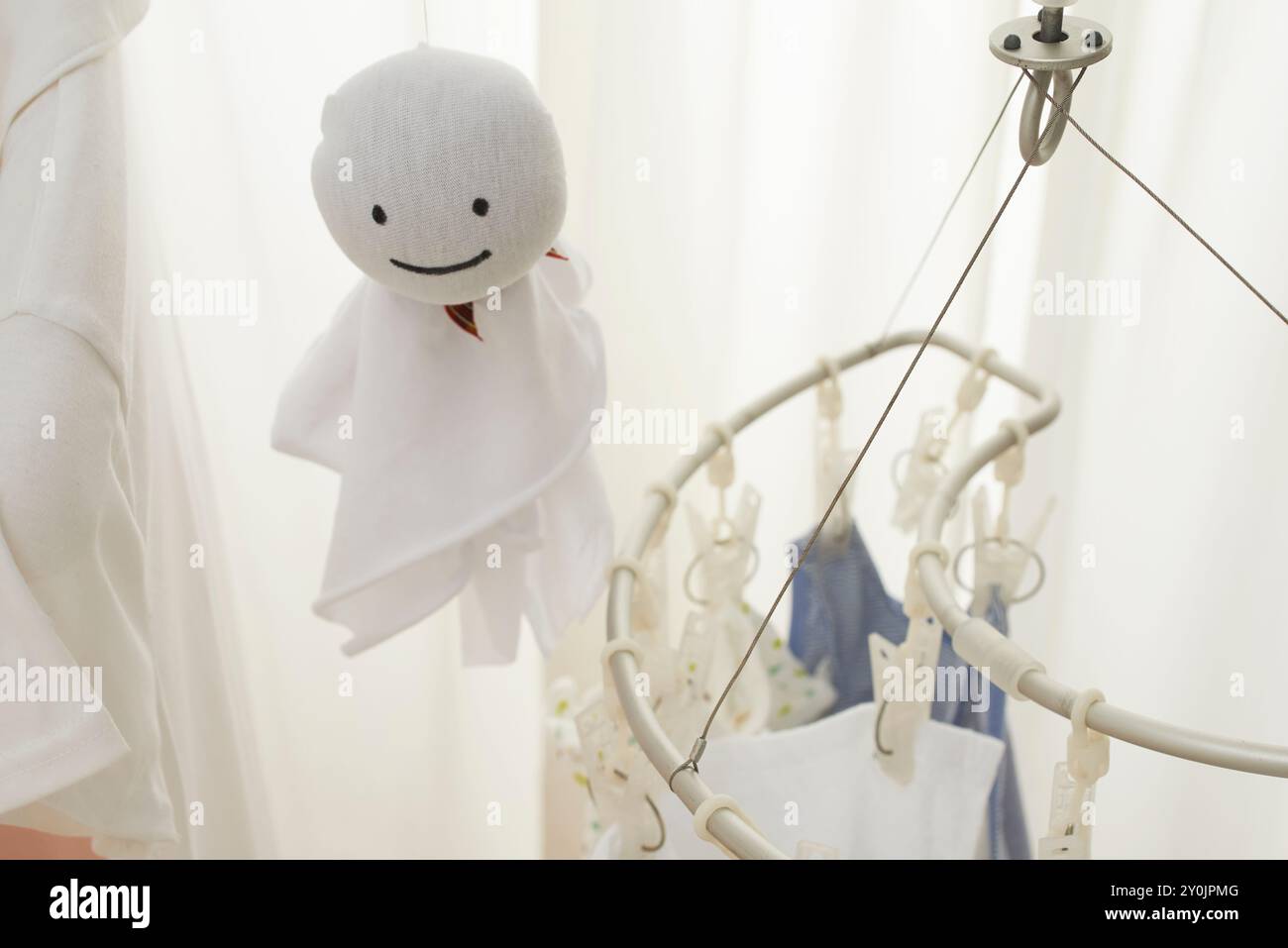 Indoor drying laundry and a paper doll Stock Photo - Alamy