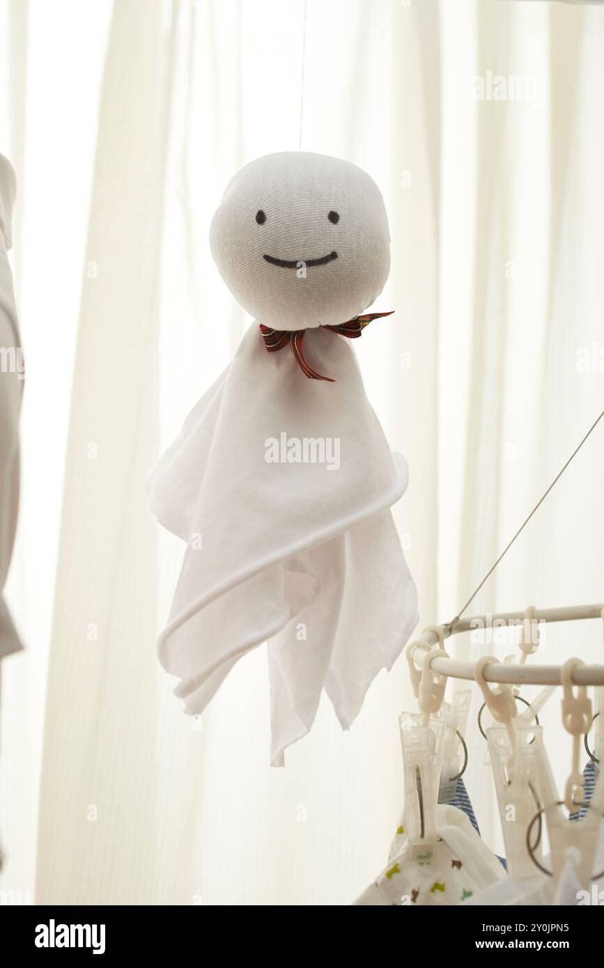 Indoor drying laundry and a paper doll Stock Photo - Alamy