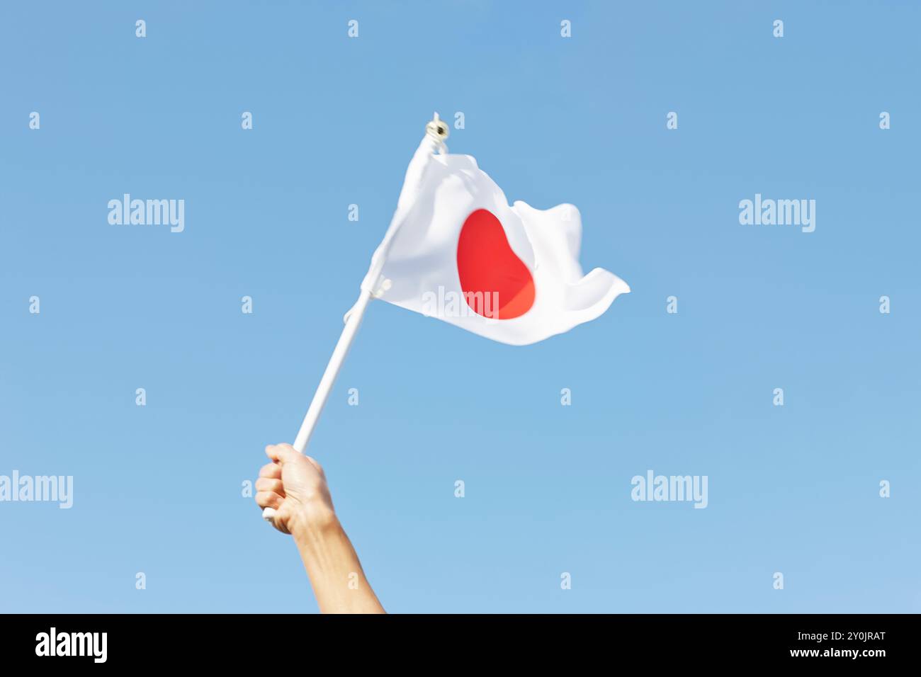 Holding japanese flag hi-res stock photography and images - Alamy