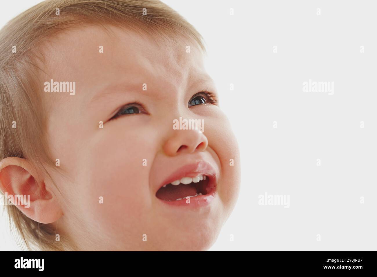 Toddler Girl's crying face Stock Photo - Alamy