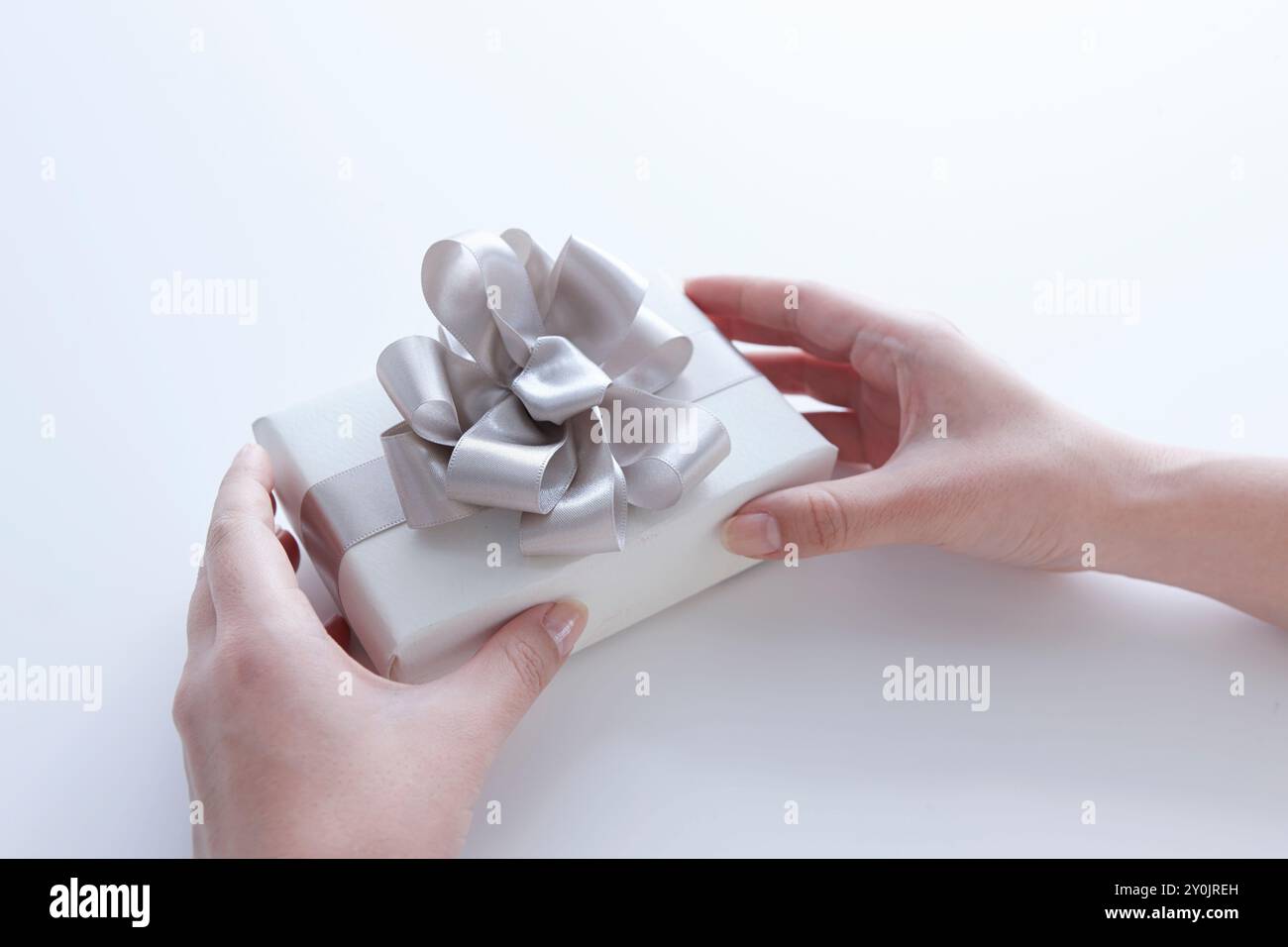 Womans hands holding gift box hi-res stock photography and images - Alamy