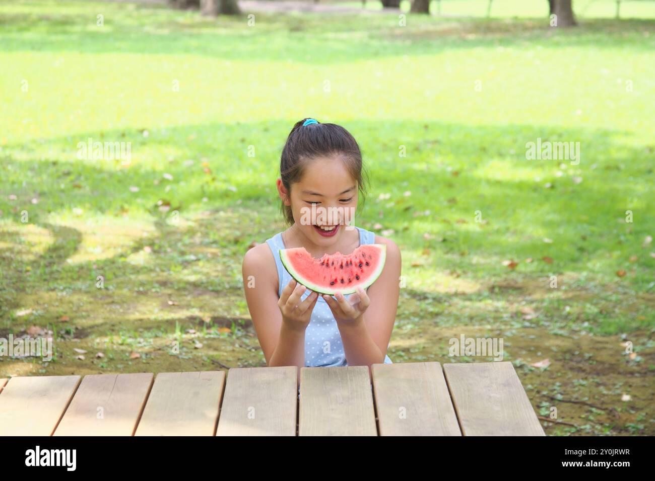 Girl eating watermelon Stock Photo - Alamy