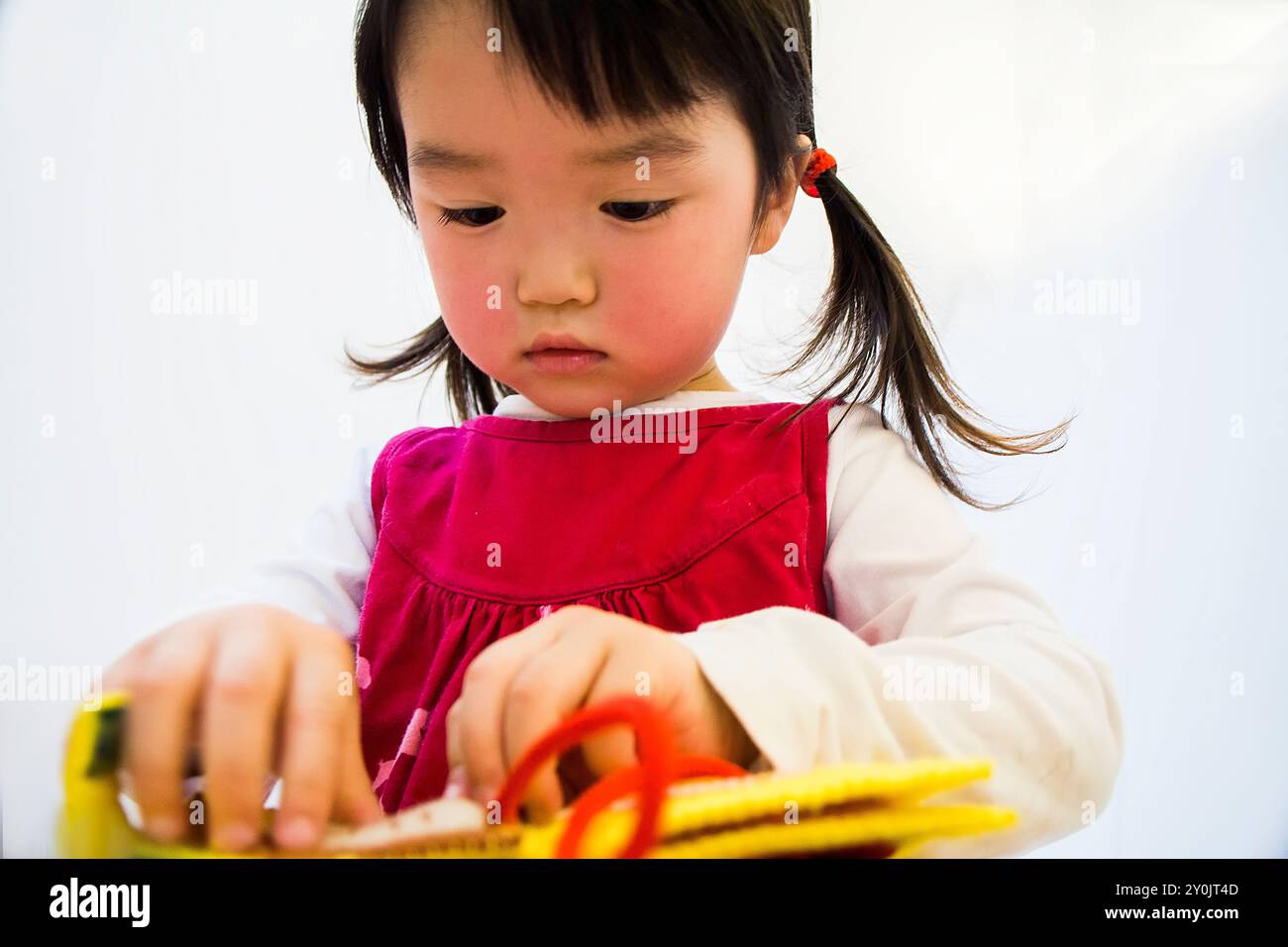 Girls playing with cloth toys Stock Photo - Alamy