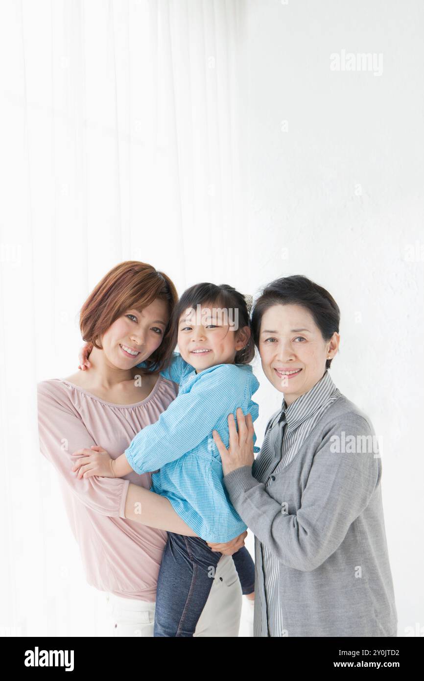 Smiling 3 generation family Stock Photo - Alamy